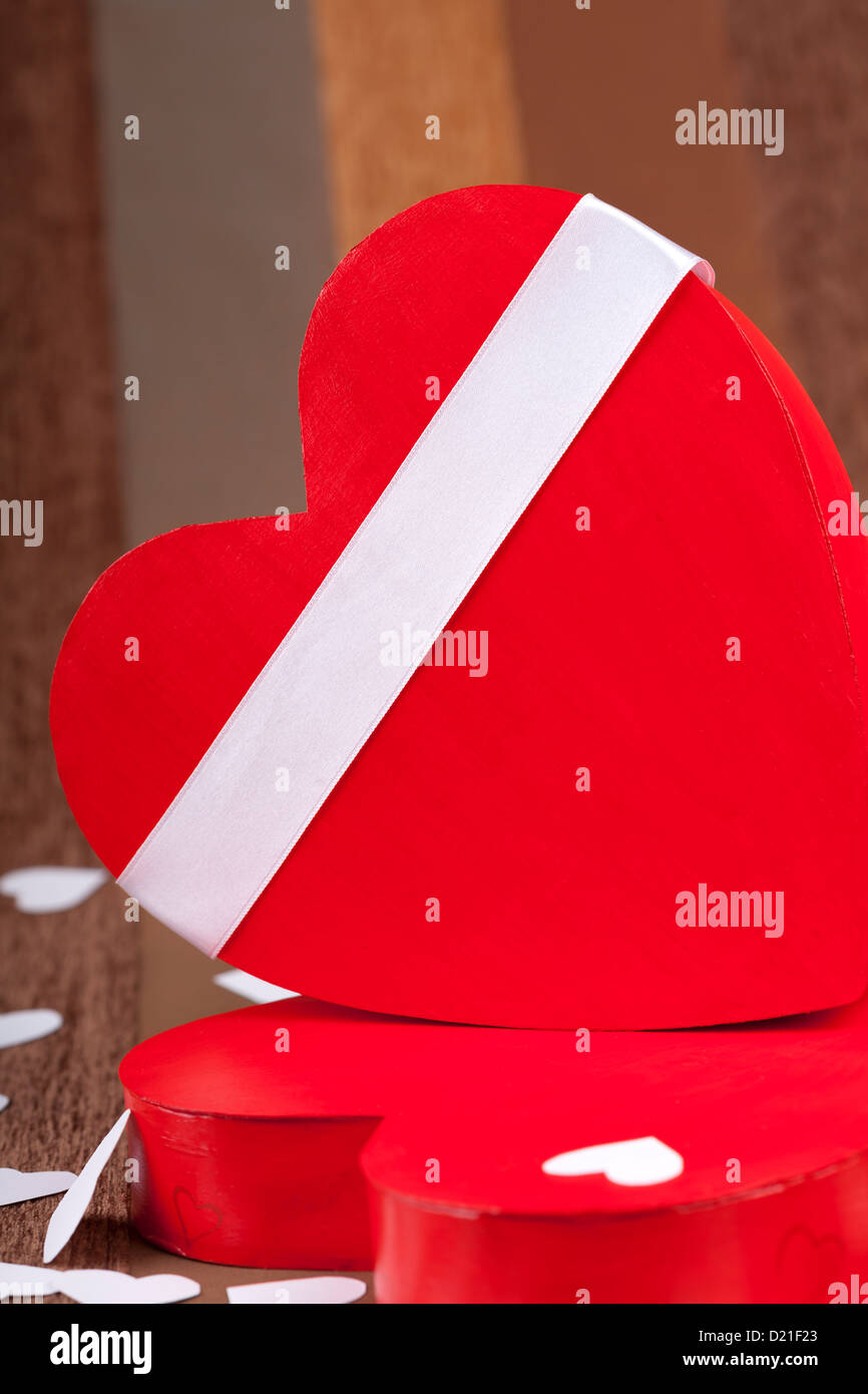 Red box in heart shape on an artistic background macro studio shot ...