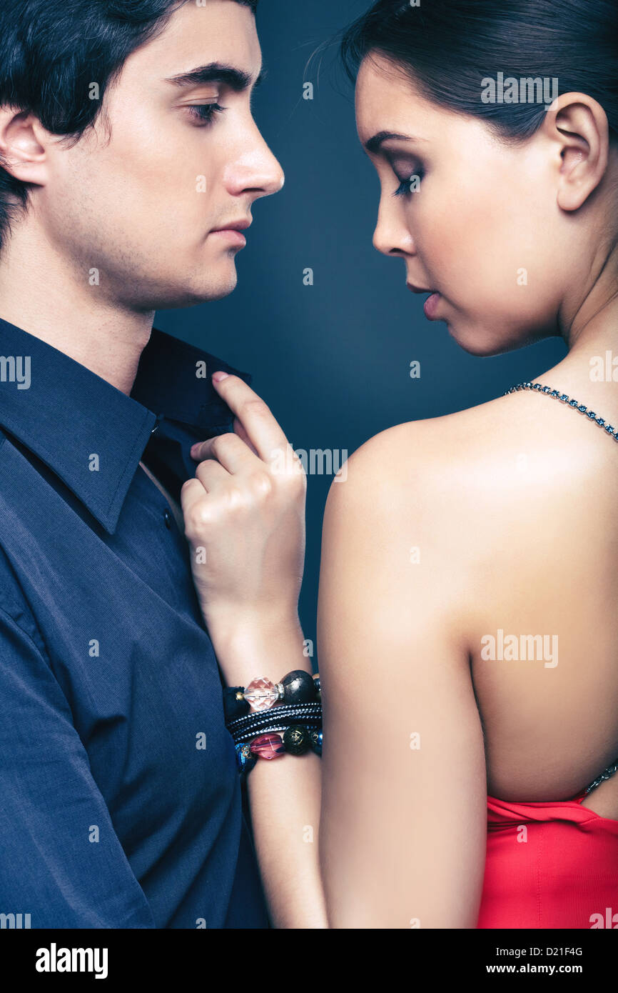 Vertical shot of a stylish couple flirting Stock Photo - Alamy