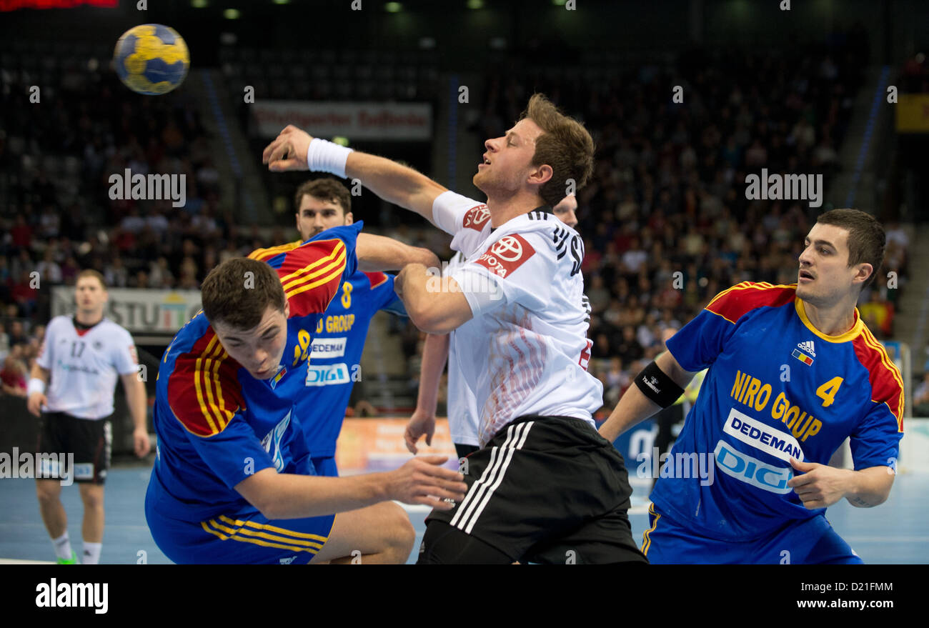 Germany's Martin Strobel (2-R) in action against Romania's Marius ...