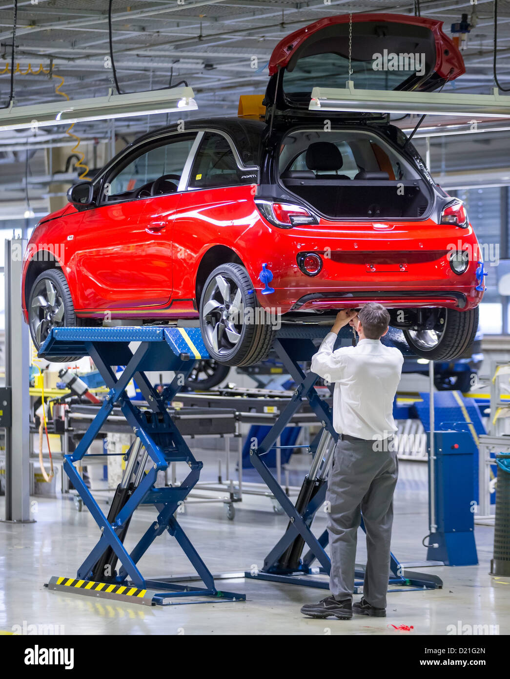 Opel employees work on the new Opel model Adam at the factory in ...