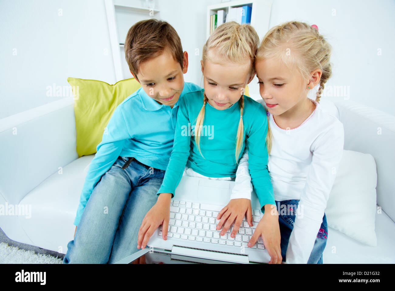Kids using laptop to communicate with their friends Stock Photo - Alamy