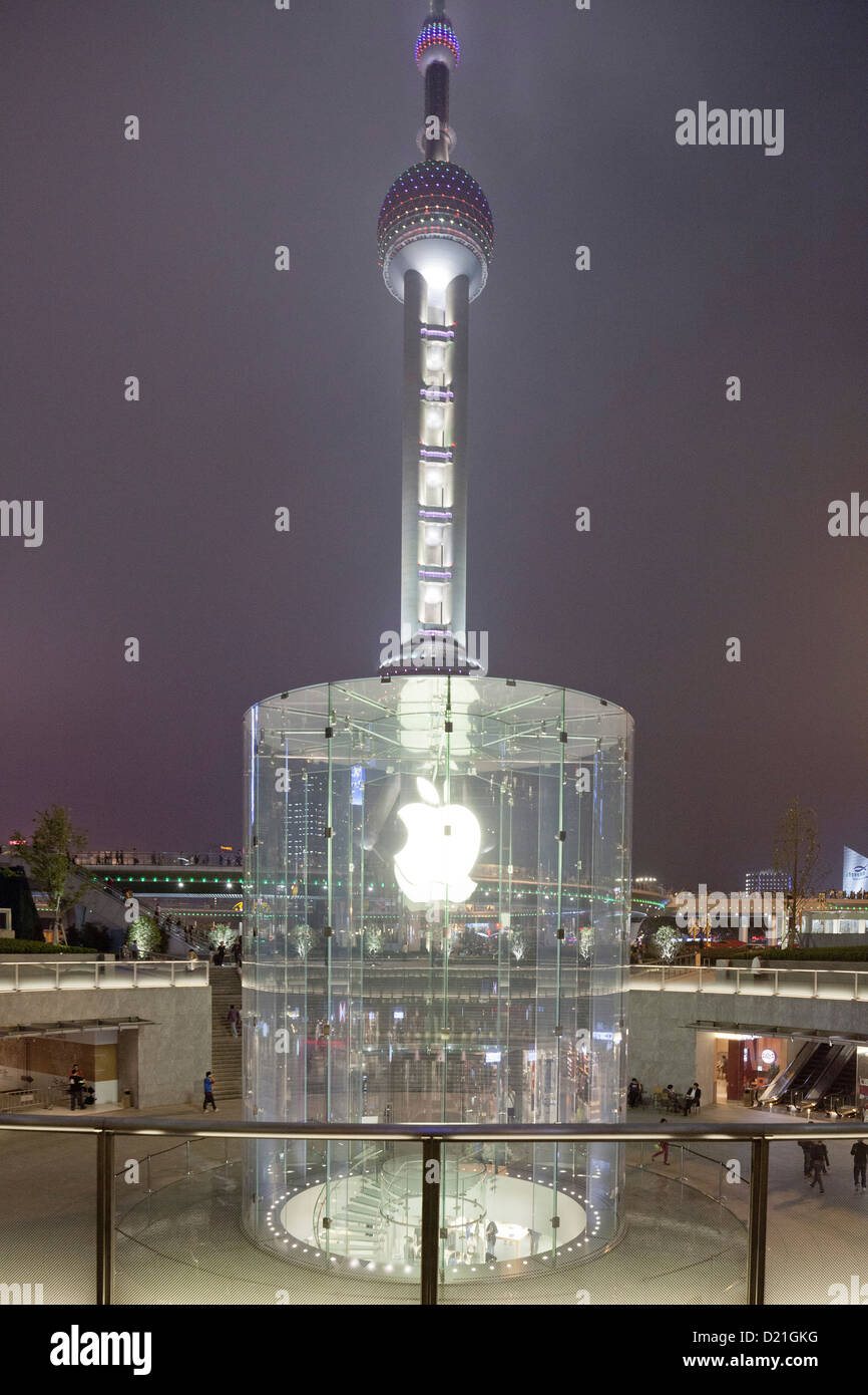 Glass stairway to Apple store in front of Oriental Pearl Tower at night ...