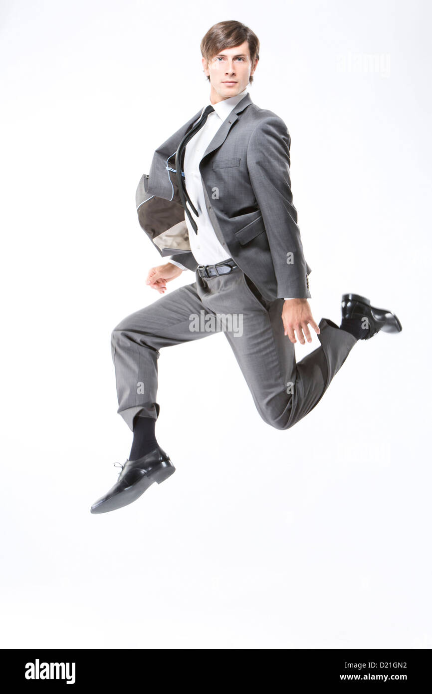 Businessman jumping, portrait Stock Photo - Alamy