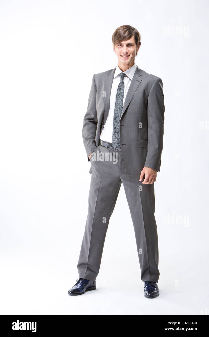 Smiling businessman standing camera Cut Out Stock Images & Pictures - Alamy