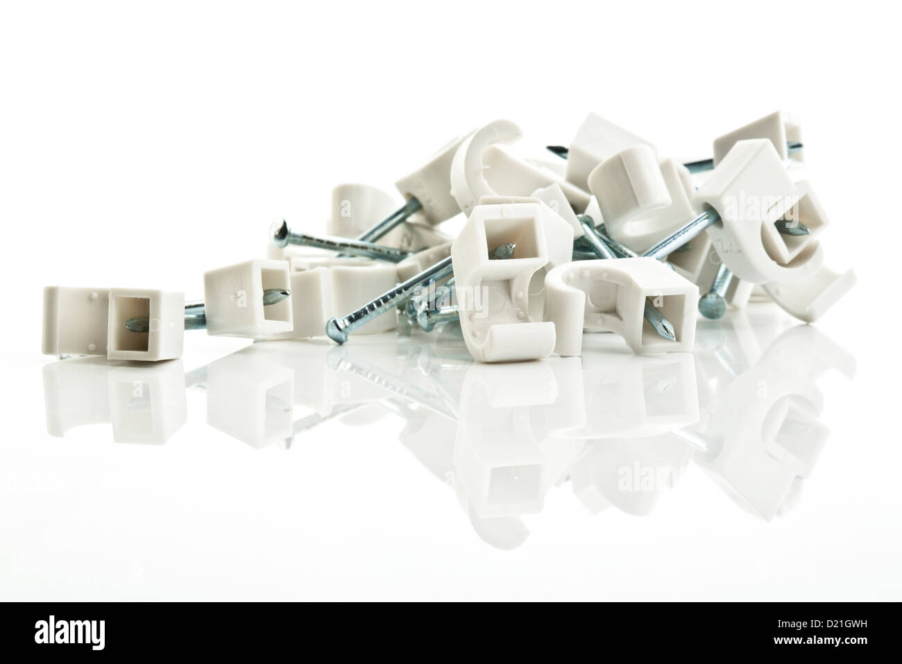Cable clips on white background Stock Photo - Alamy