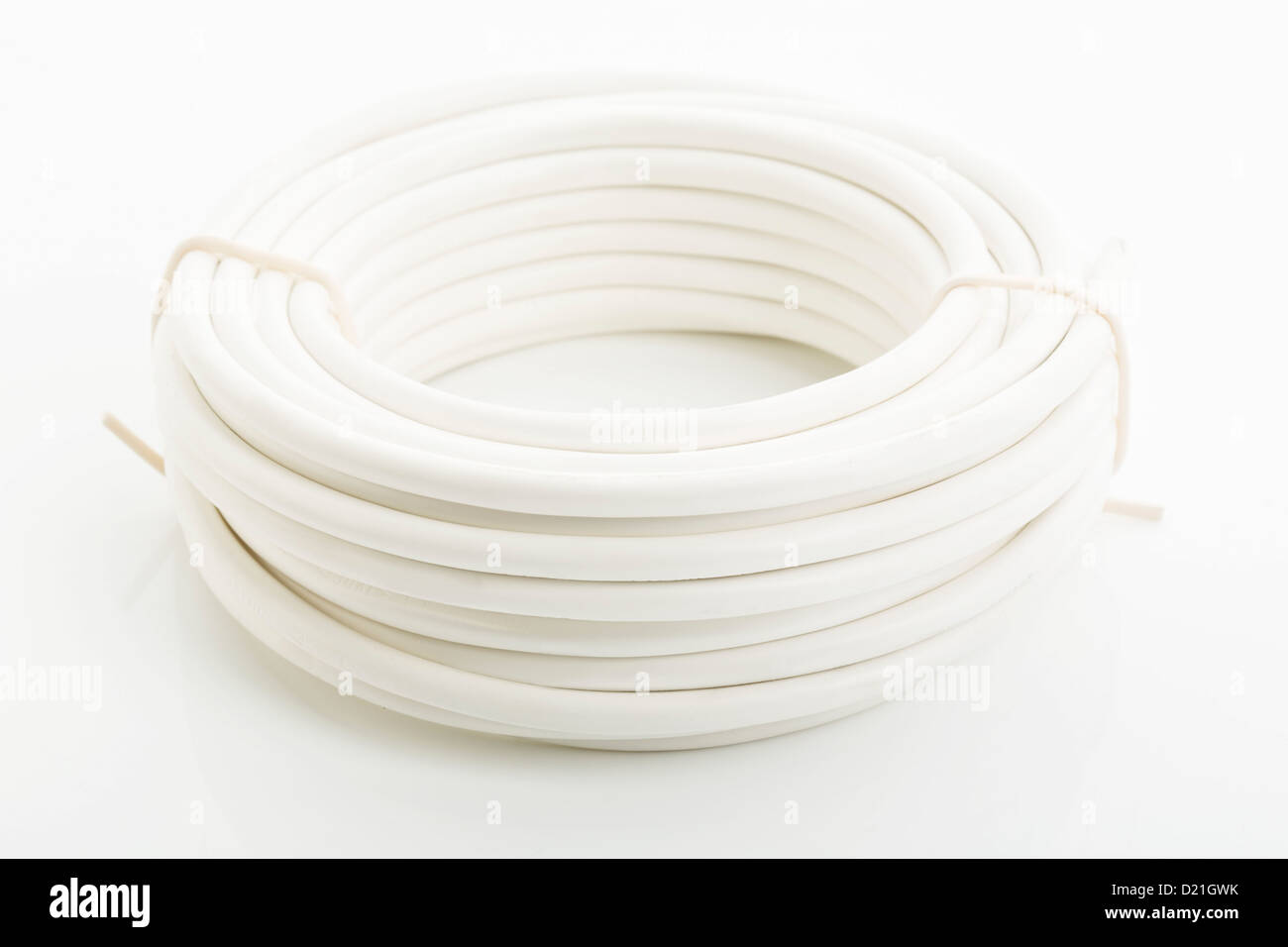 Close up of rolled electric cable on white background Stock Photo - Alamy