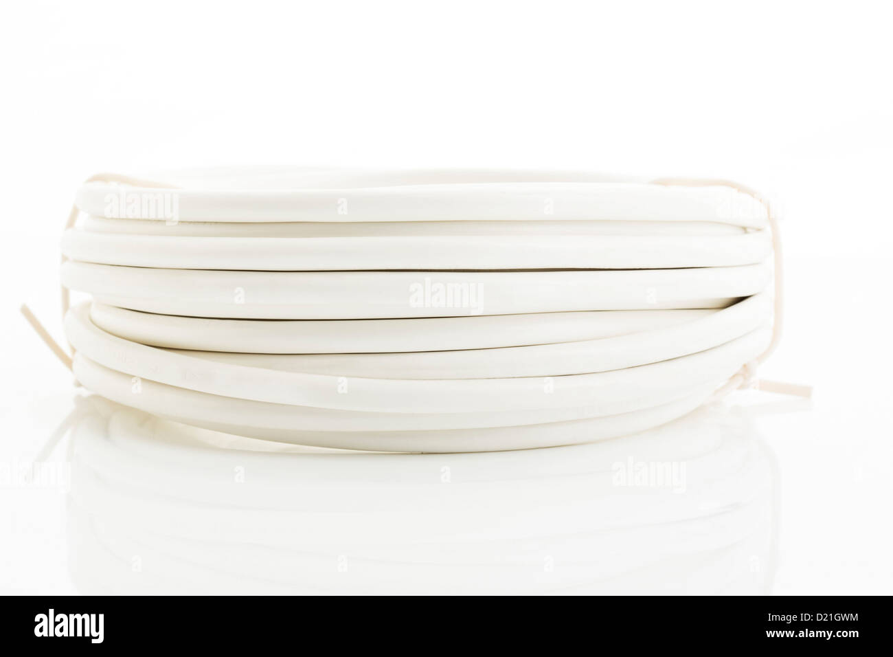 Close up of rolled electric cable on white background Stock Photo - Alamy