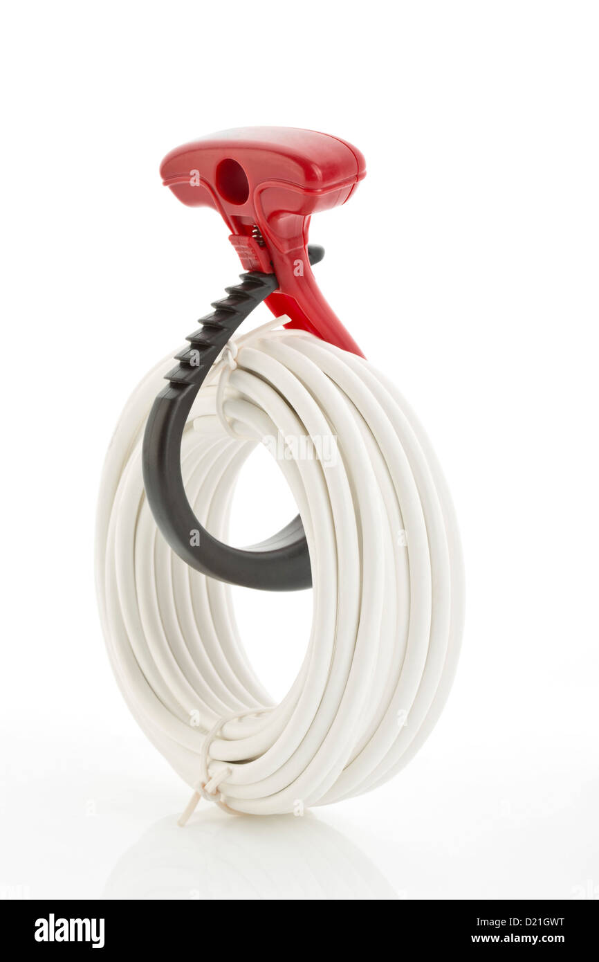 Cable clamp with electric cable on white background Stock Photo - Alamy