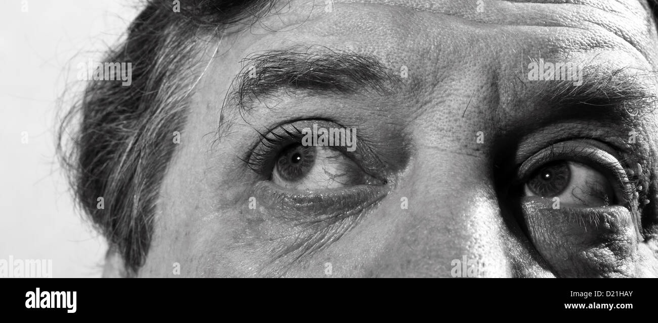 Close up serious man eyes hi-res stock photography and images - Alamy