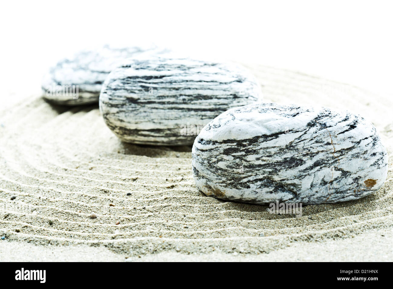 Marble stones on sand, close up Stock Photo - Alamy
