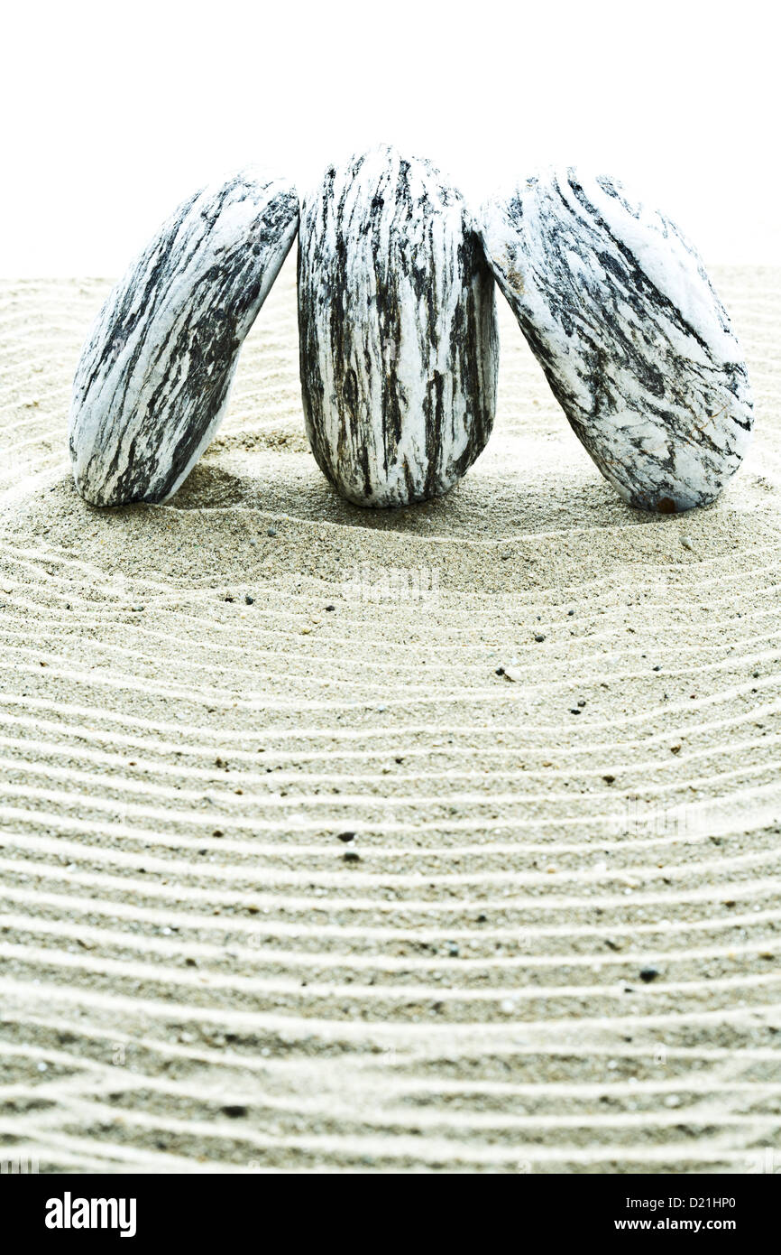 Marble stones on sand, close up Stock Photo - Alamy
