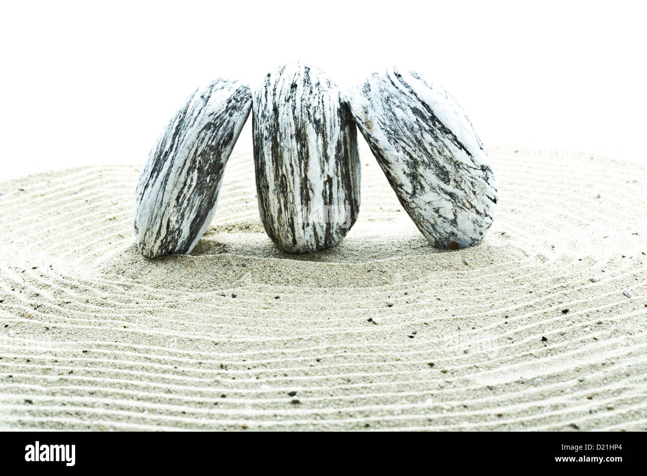 Marble stones on sand, close up Stock Photo - Alamy