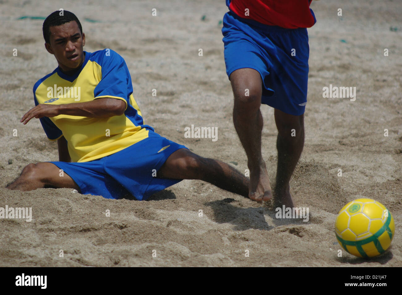 Ciudad de Panamá (Panama): men playing soccer on a beach by the Casco ...