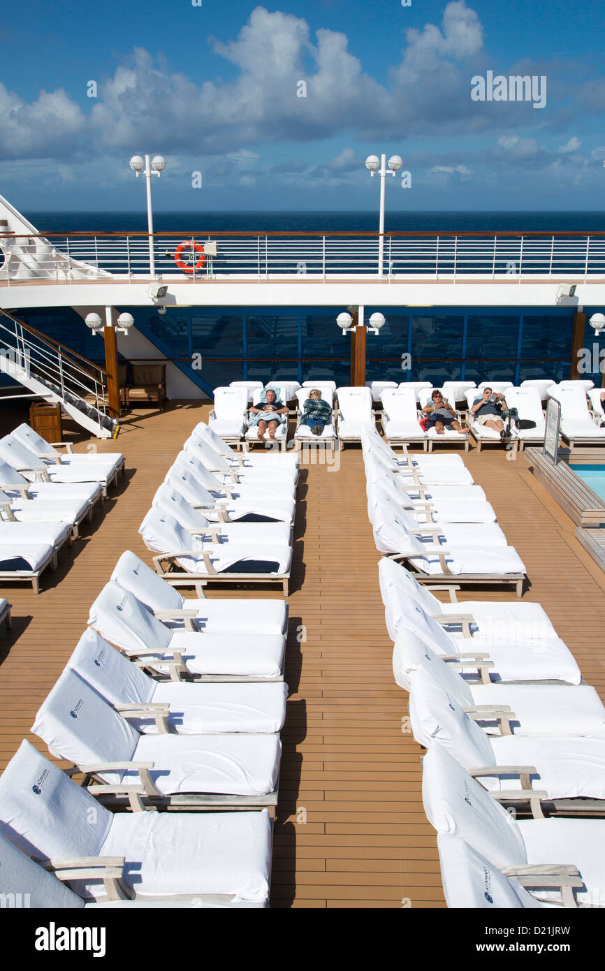 Lounge chairs on pool deck of cruise ship Azamara Journey, Azamara Club ...