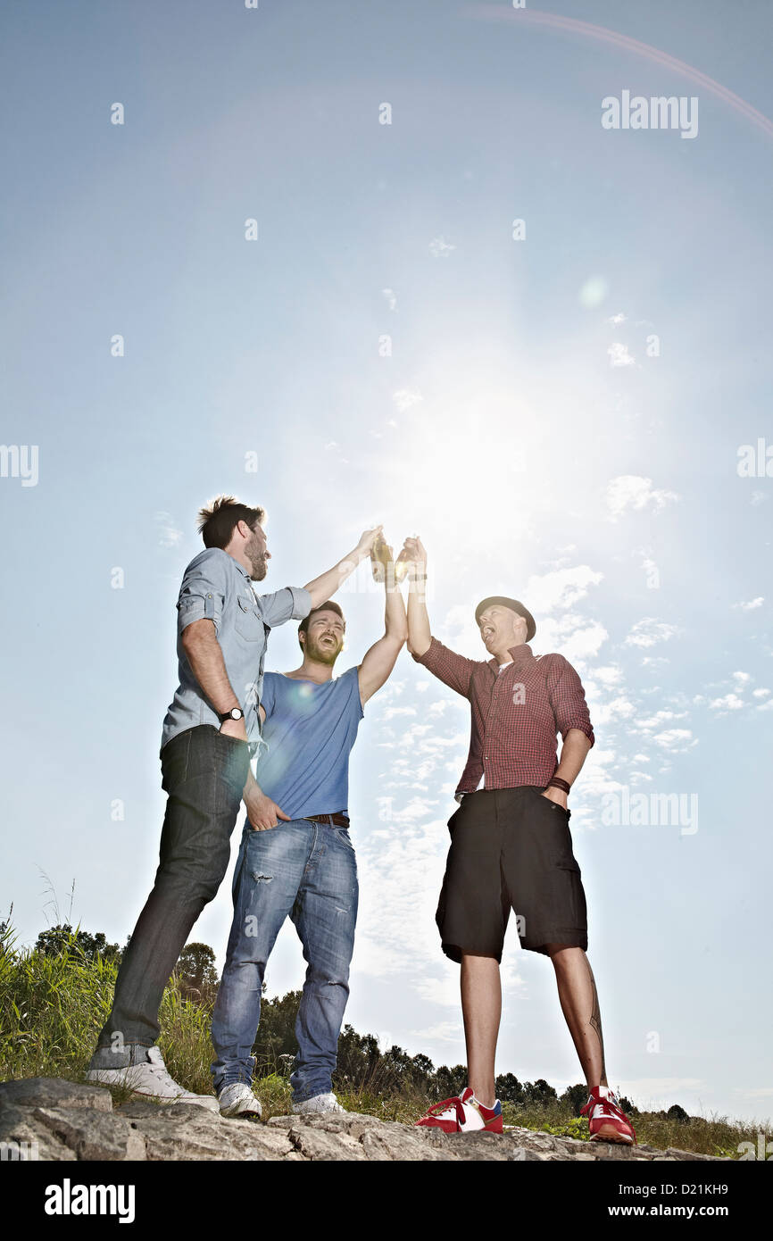Germany, Cologne, Young men drinking beer Stock Photo - Alamy