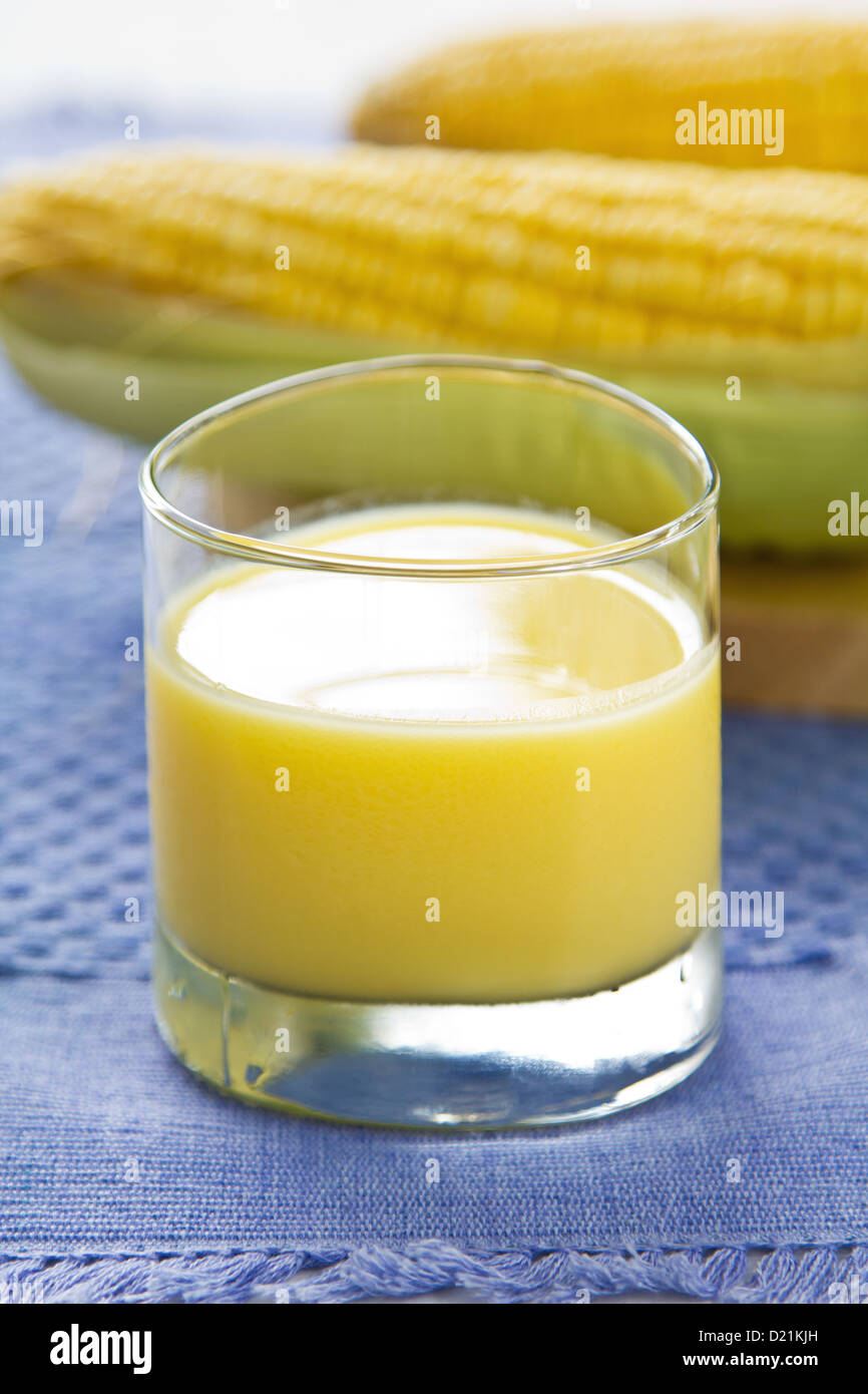 Fresh sweet corn juice by raw corns Stock Photo - Alamy
