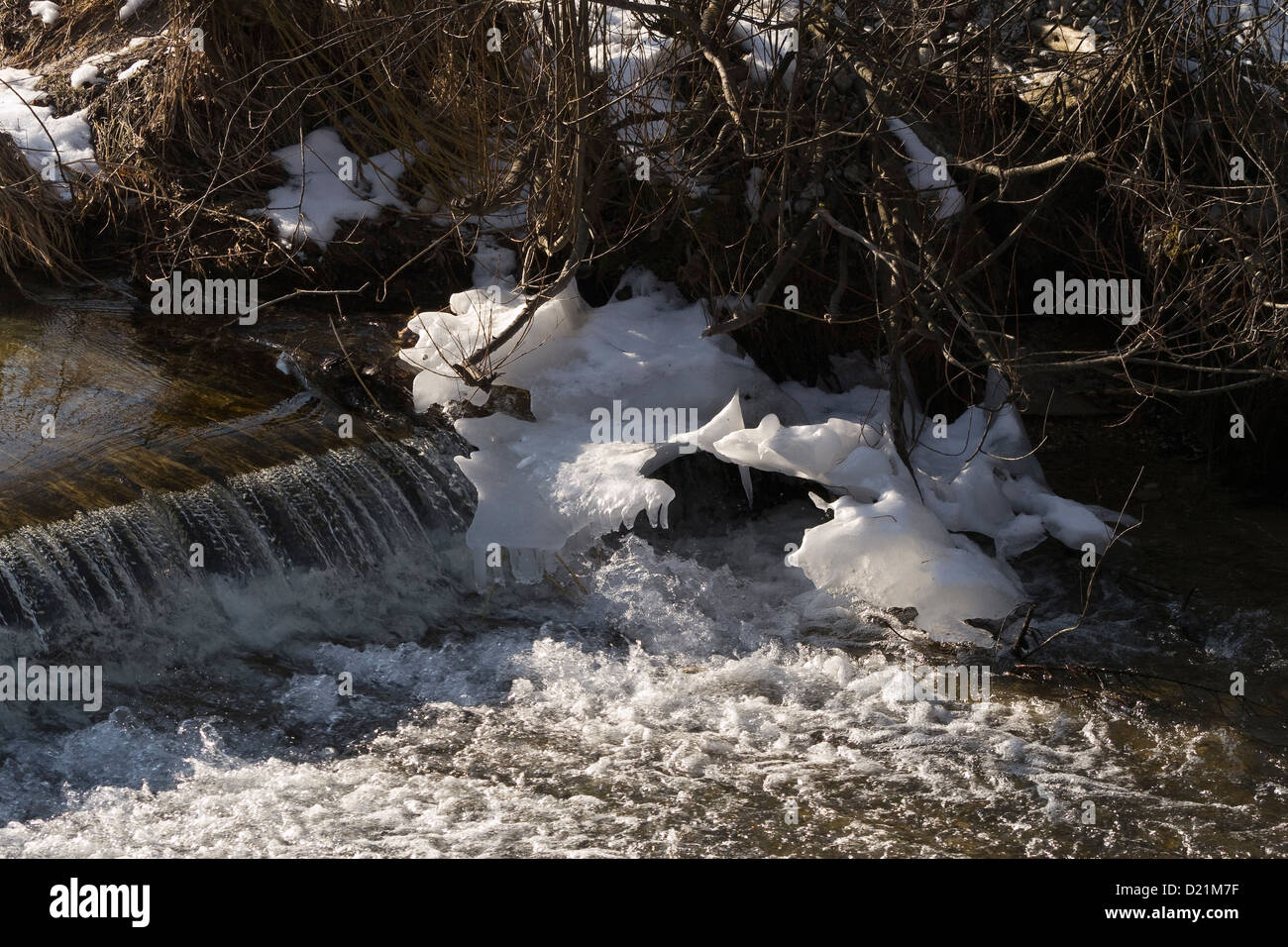 stream and small waterfall creating strange ice shapes Stock Photo - Alamy