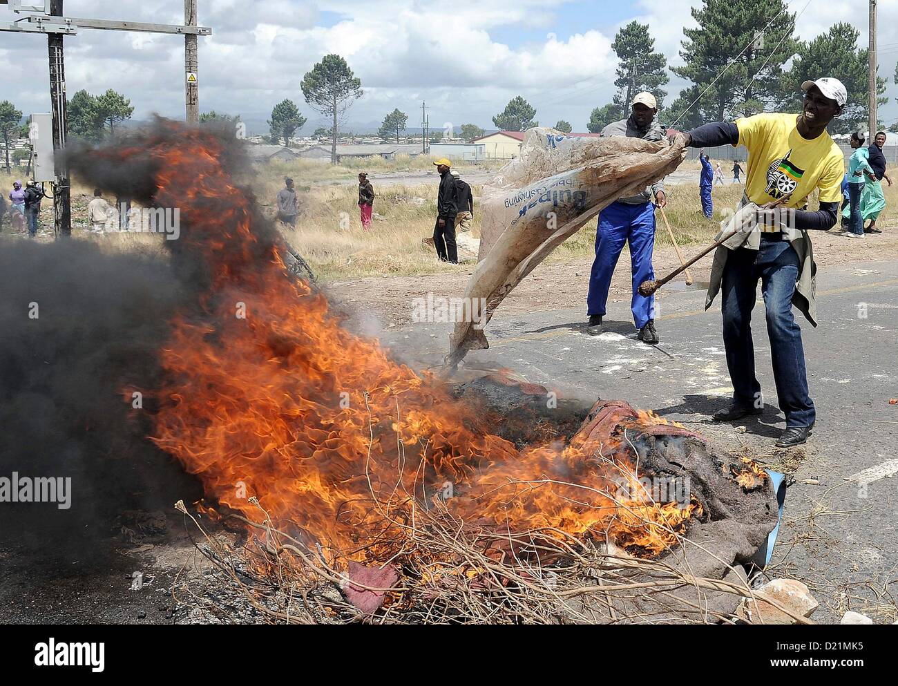 GRABOUW, SOUTH AFRICA: Protestors start a fire on the N2 highway on ...