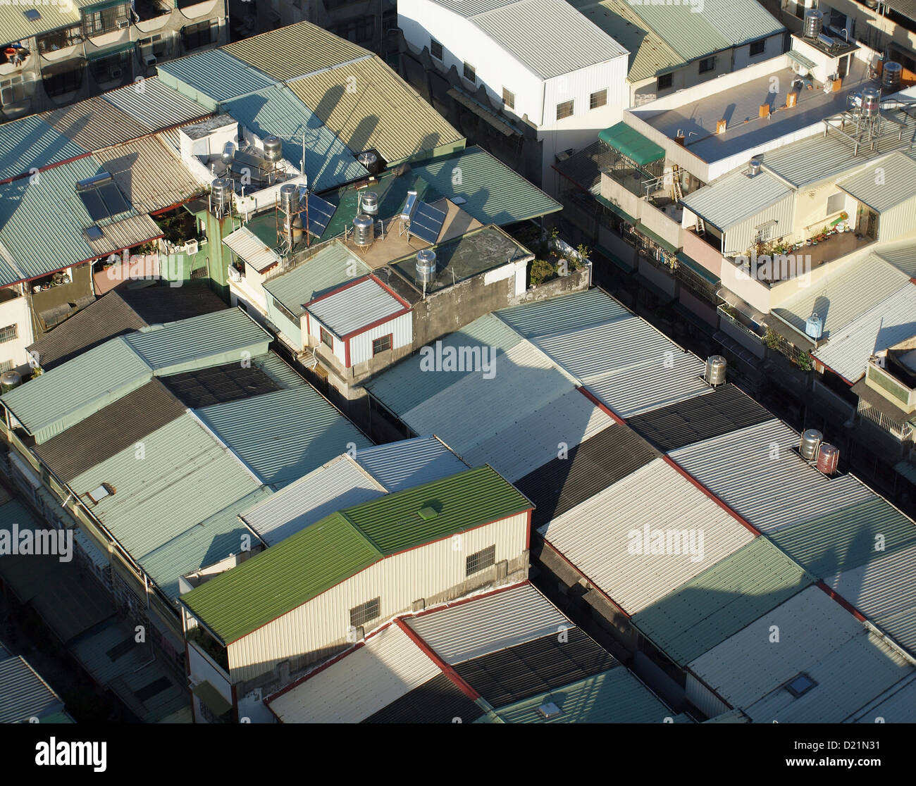 A crowded residential area in a city seen from above. This a local ...