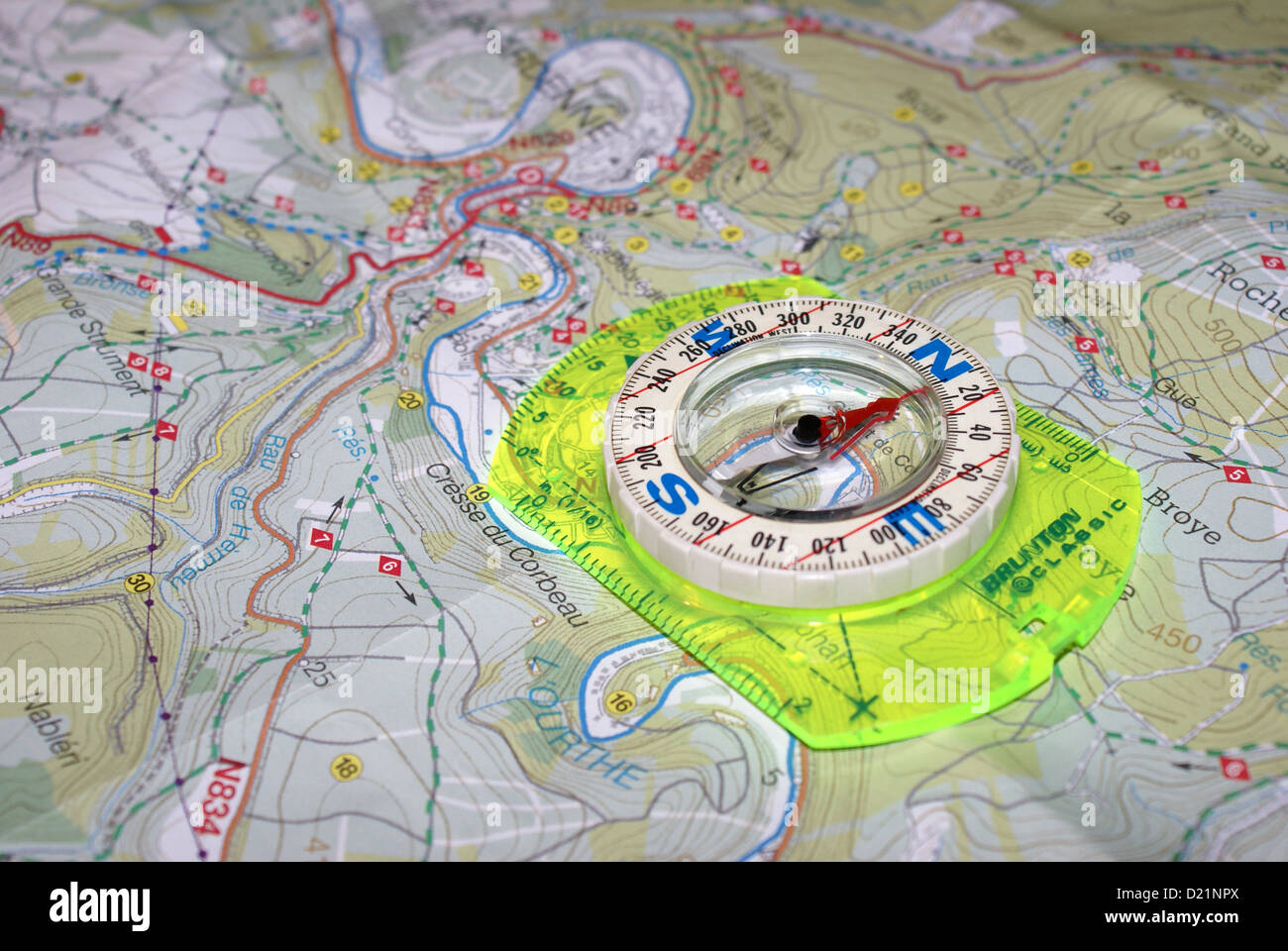 A compass on top of a road map hi-res stock photography and images - Alamy