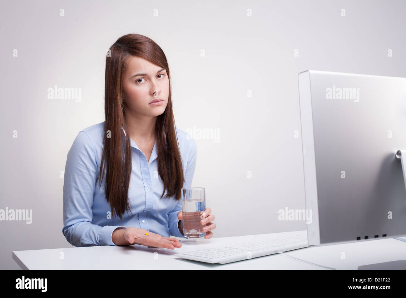 beautiful girl is sick at work Stock Photo - Alamy