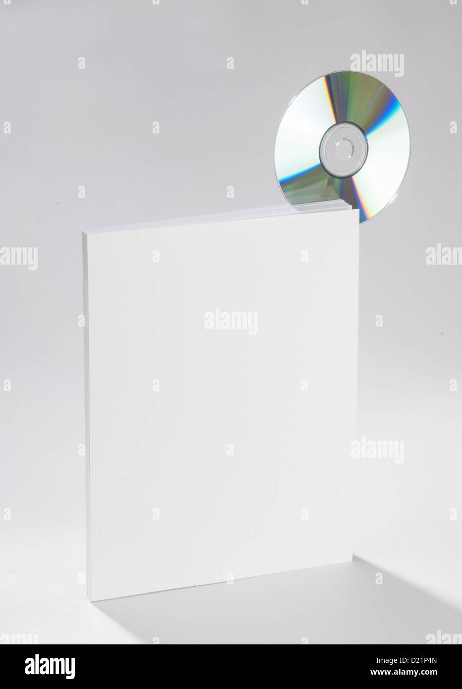 Blank CD and book on white ground Stock Photo - Alamy