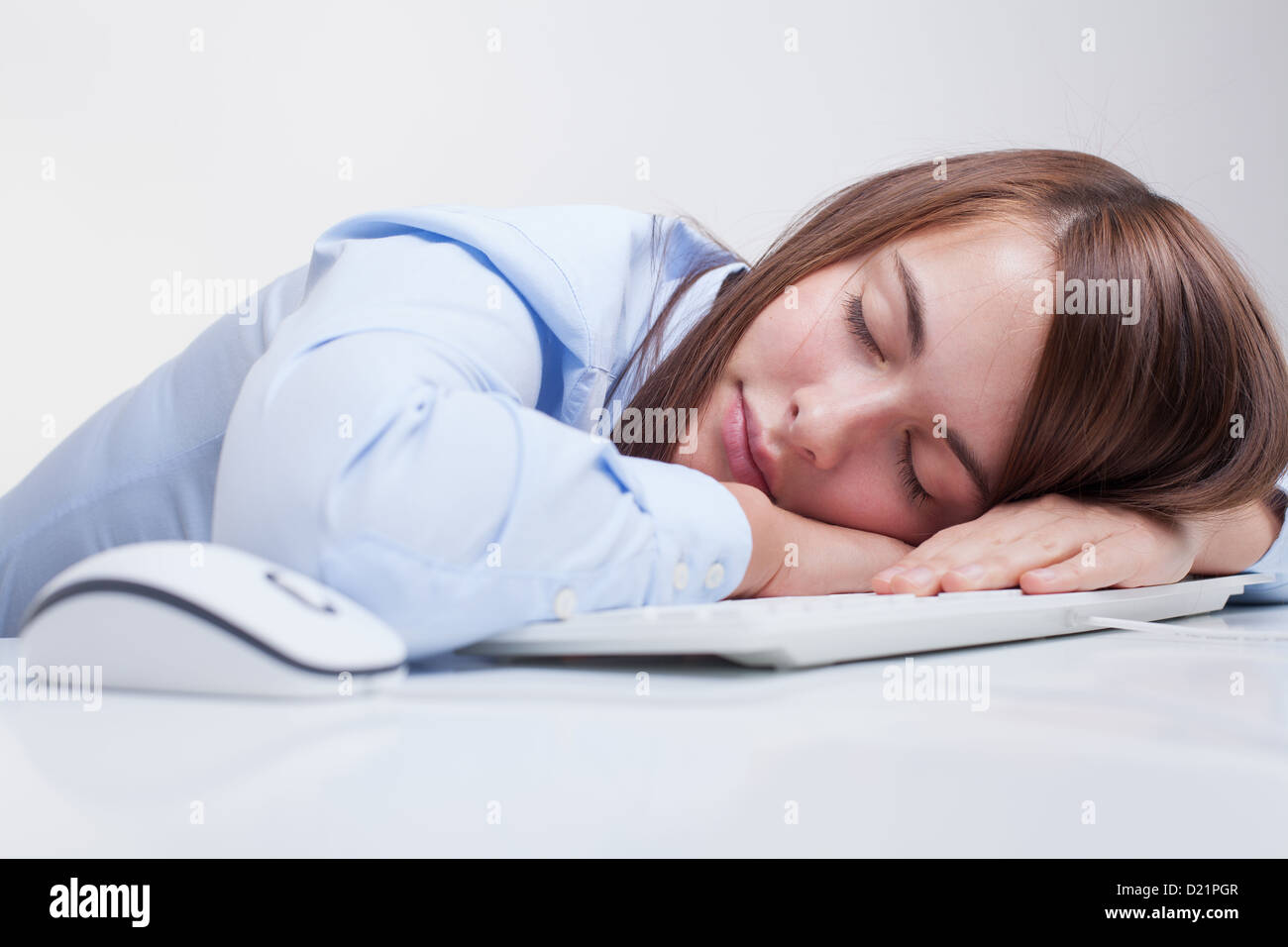 Beautiful woman tired at work Stock Photo - Alamy