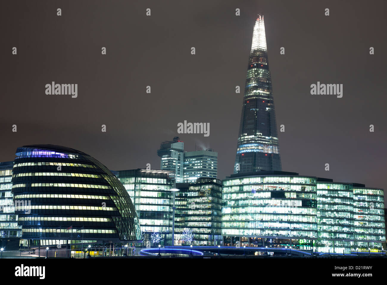 A landscape view of The Shard in London at Night sitting behind City ...