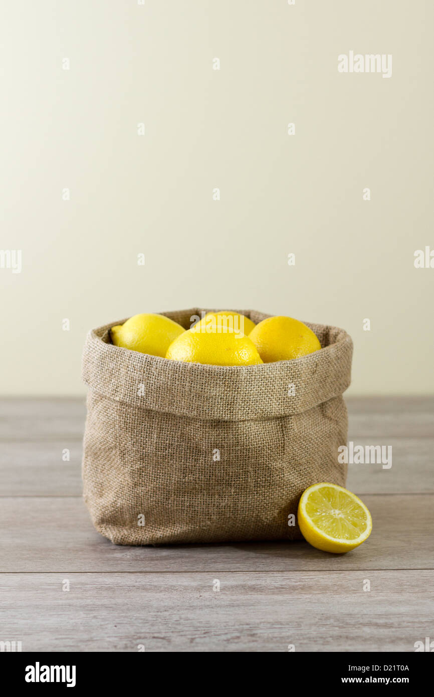 Jute sack of lemons, vertical Stock Photo - Alamy