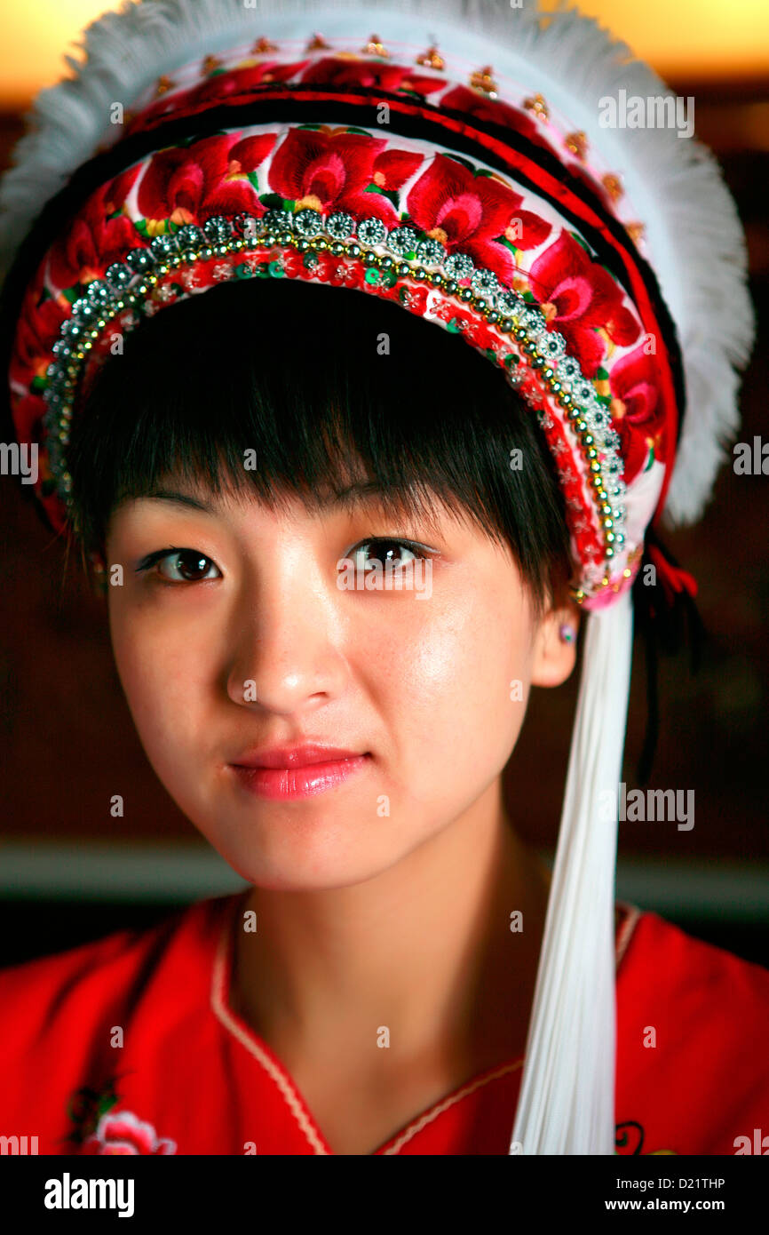 Portrait of a traditional Bai woman wearing traditional costume in Dali ...