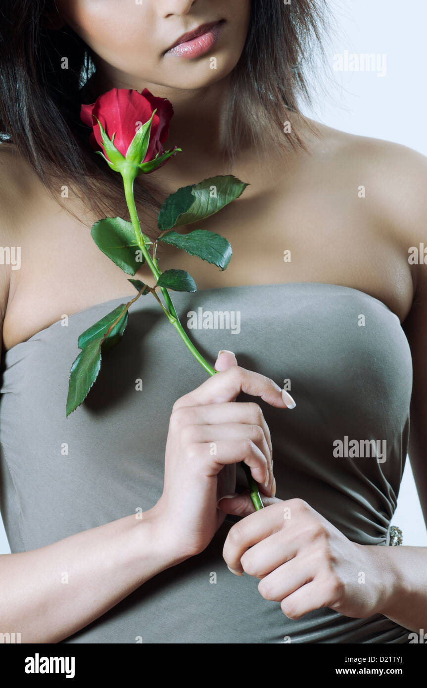 Woman with red rose Stock Photo - Alamy