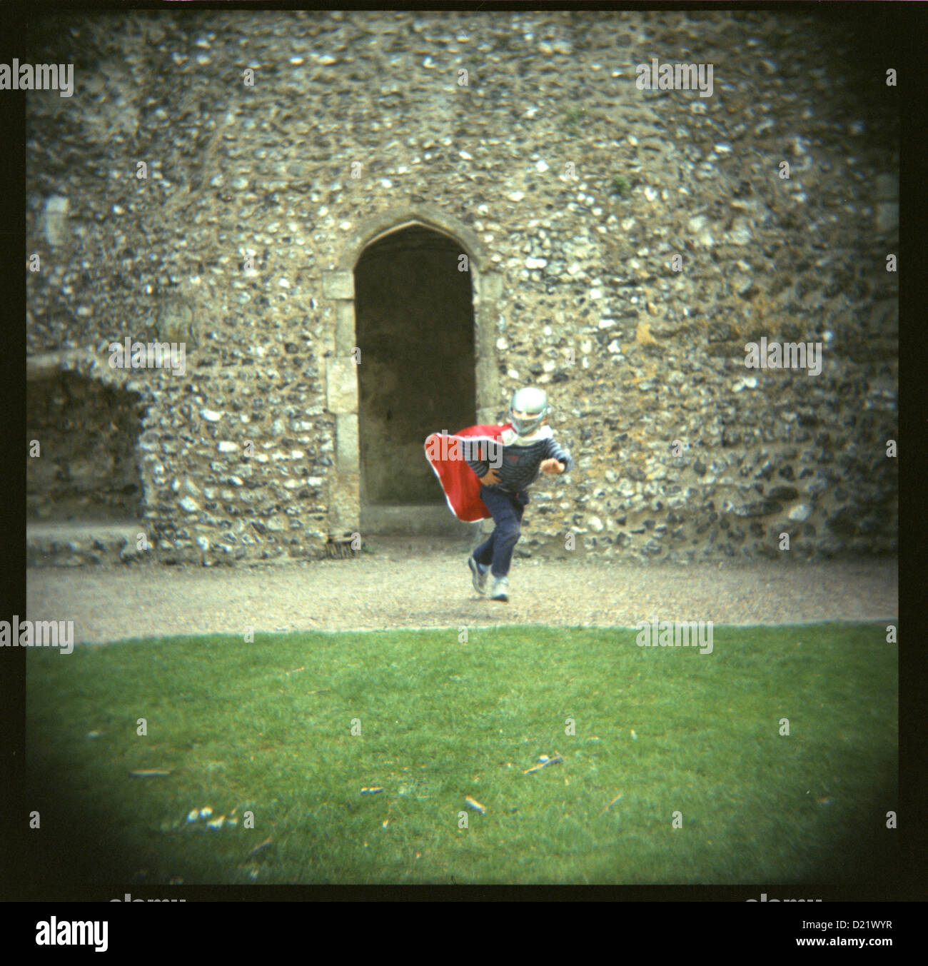 Boy Dressed As Knight Running Out Of Castle Stock Photo - Alamy