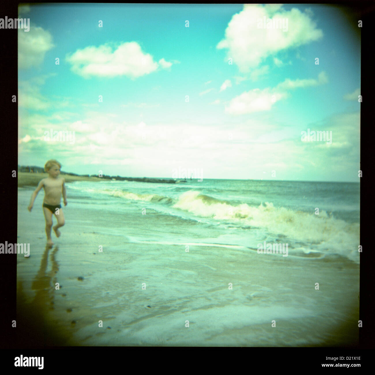 Boy on Beach Stock Photo - Alamy