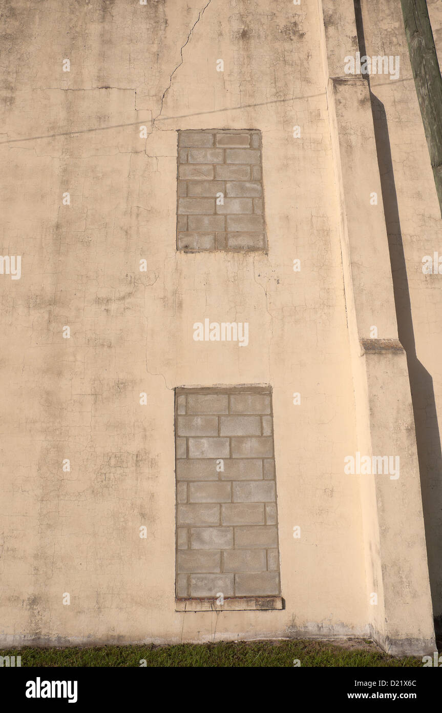 Blocked in window on exterior of old building Stock Photo - Alamy