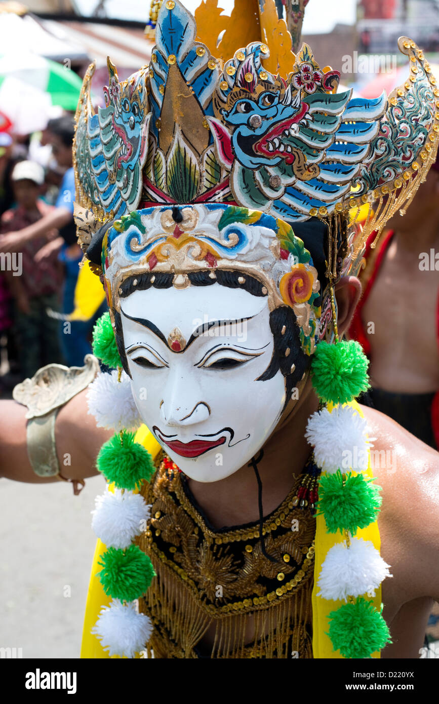 A dancer wearing a traditional painted mask takes part in a Harvest ...