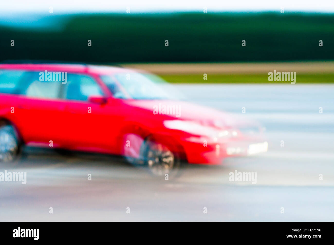 An abstract image of drunk driver driving red car Stock Photo - Alamy