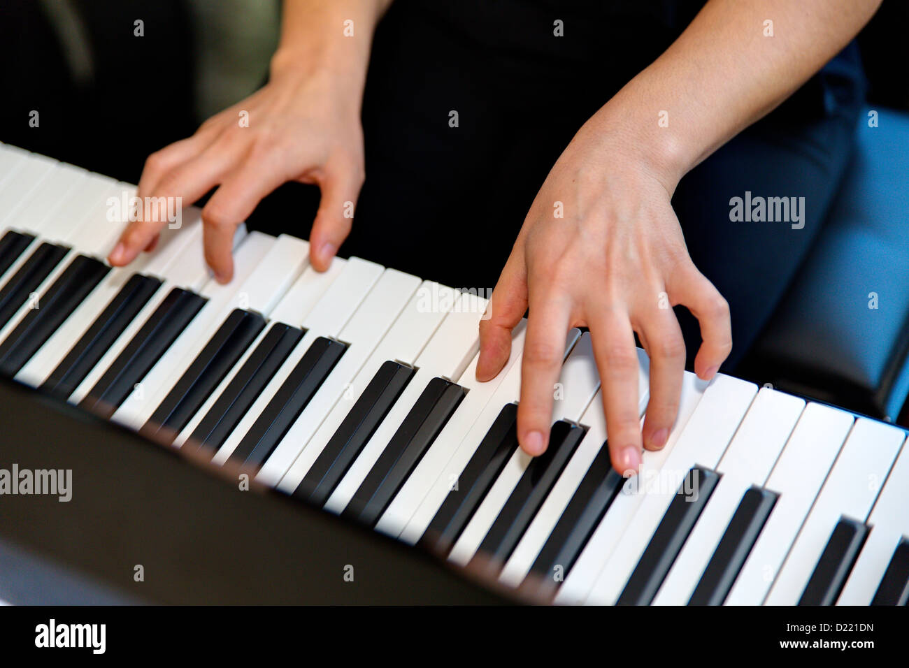 Hands playing piano Stock Photo - Alamy