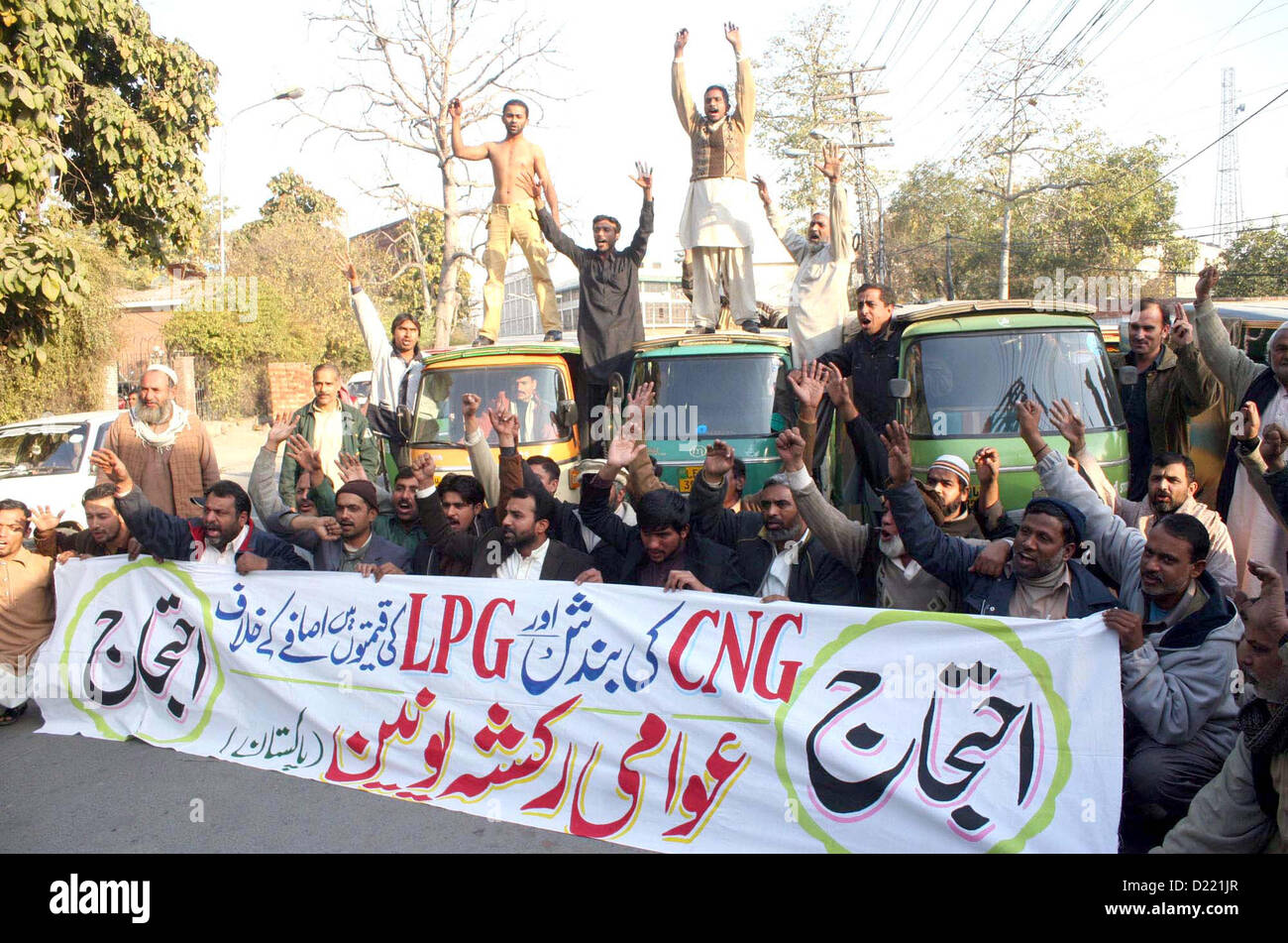 Members of Awami Rickshaw Union chant slogans against non-availability ...