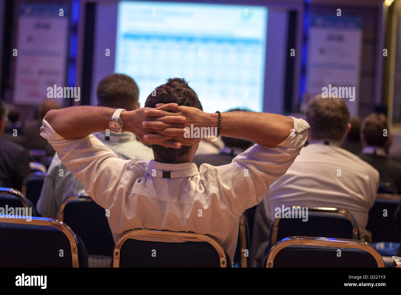 Business man during a conference presentation Stock Photo - Alamy