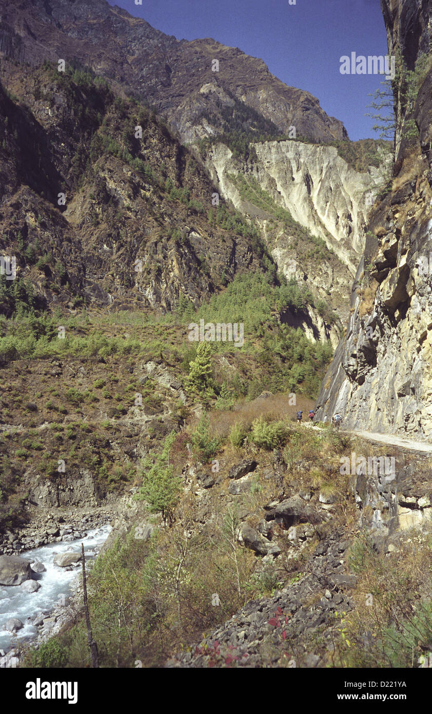 Trekkers on cliff path hewn out of solid rock between Bhratang and ...