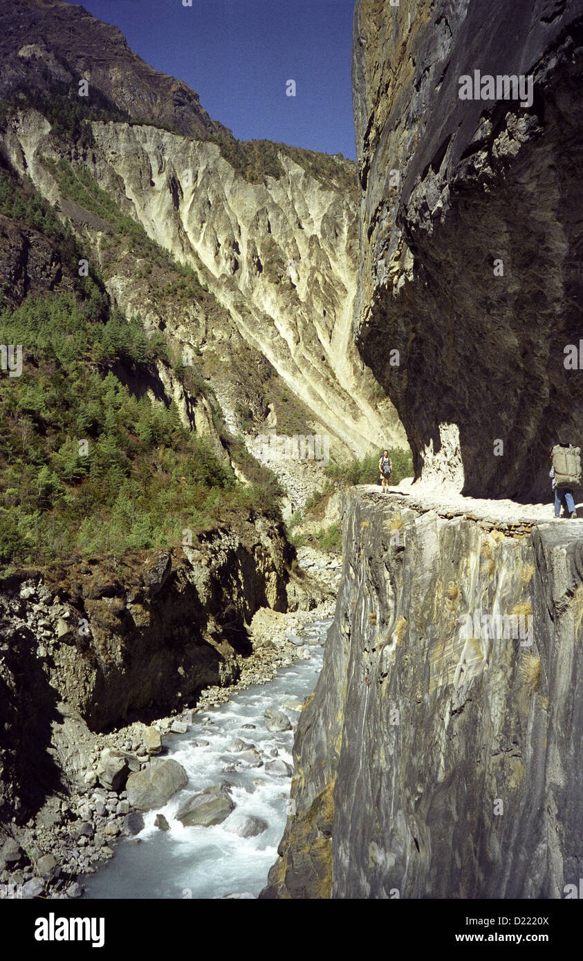 Trekkers on cliff path hewn out of solid rock between Bhratang and ...
