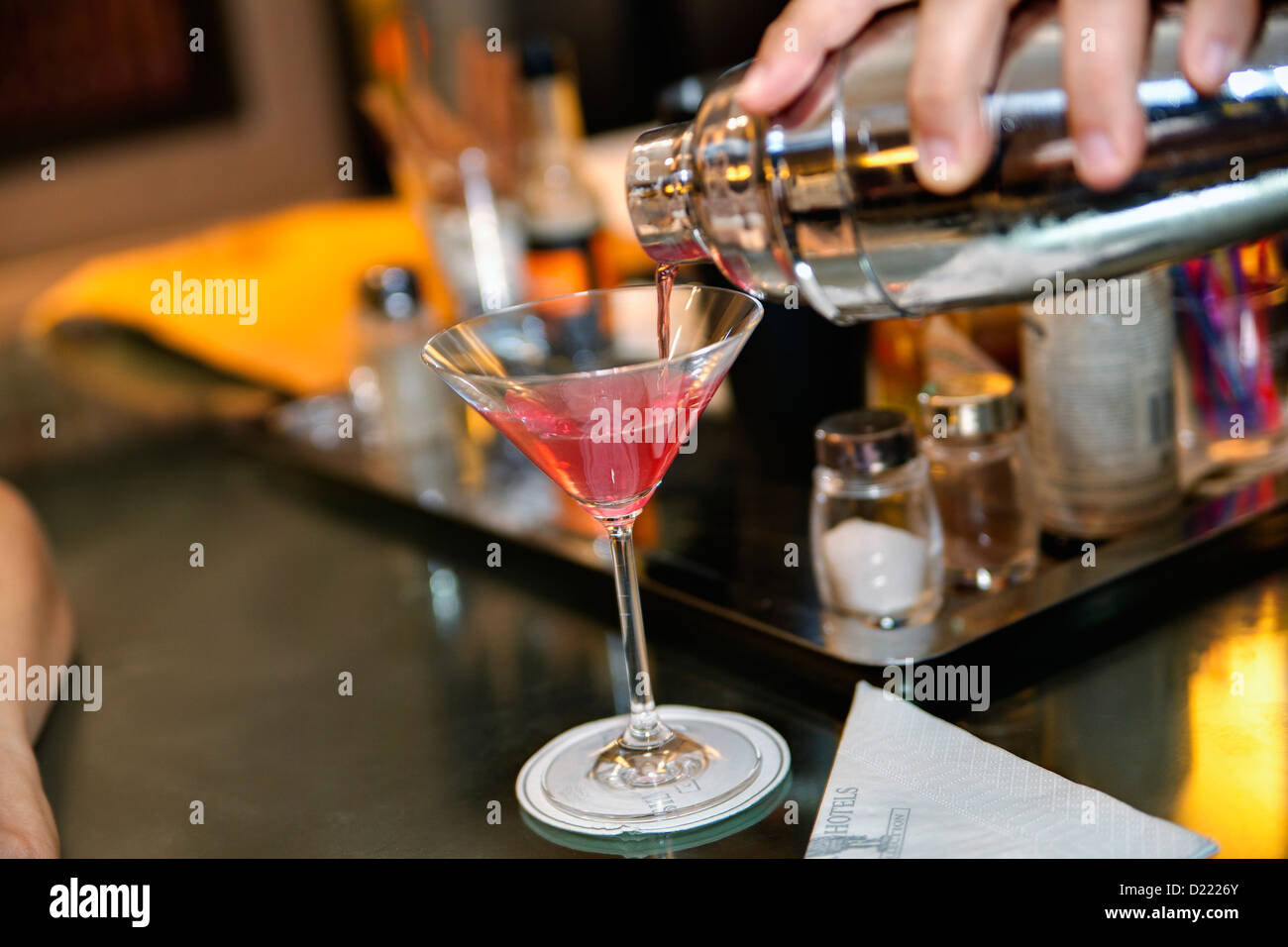 Pouring a cocktail drink Stock Photo - Alamy