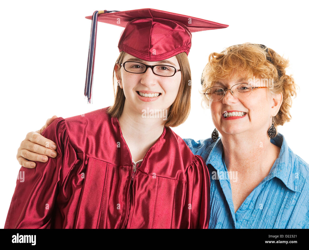 Female graduate in cap and gown with her proud mother. Isolated on ...