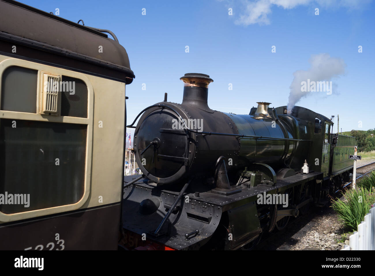 Steam train pushing carriage Stock Photo - Alamy