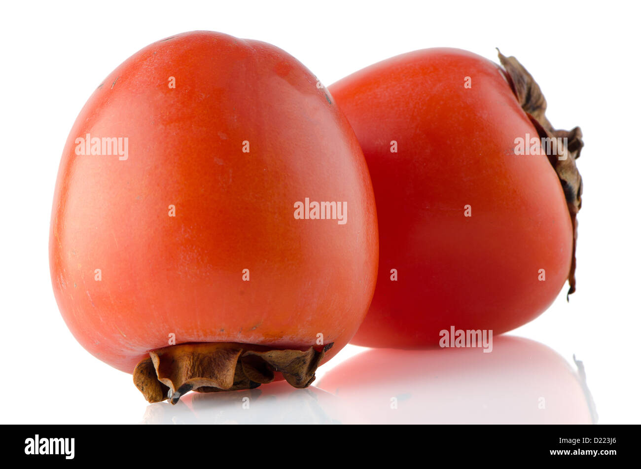 Red ripe persimmons isolated over white background Stock Photo - Alamy