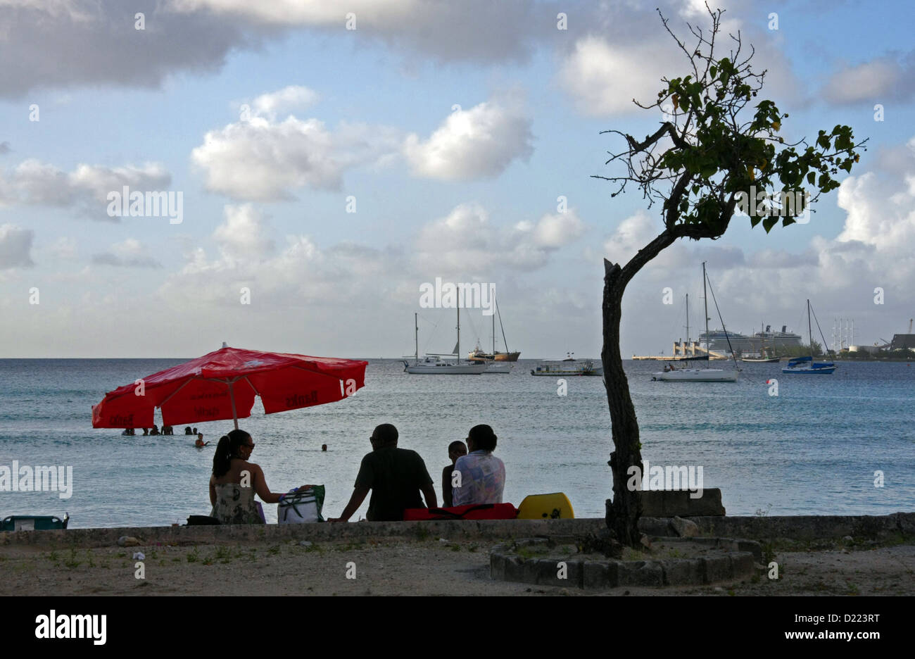 a family at dusk enjoying the view at the beach at Needham's Point ...