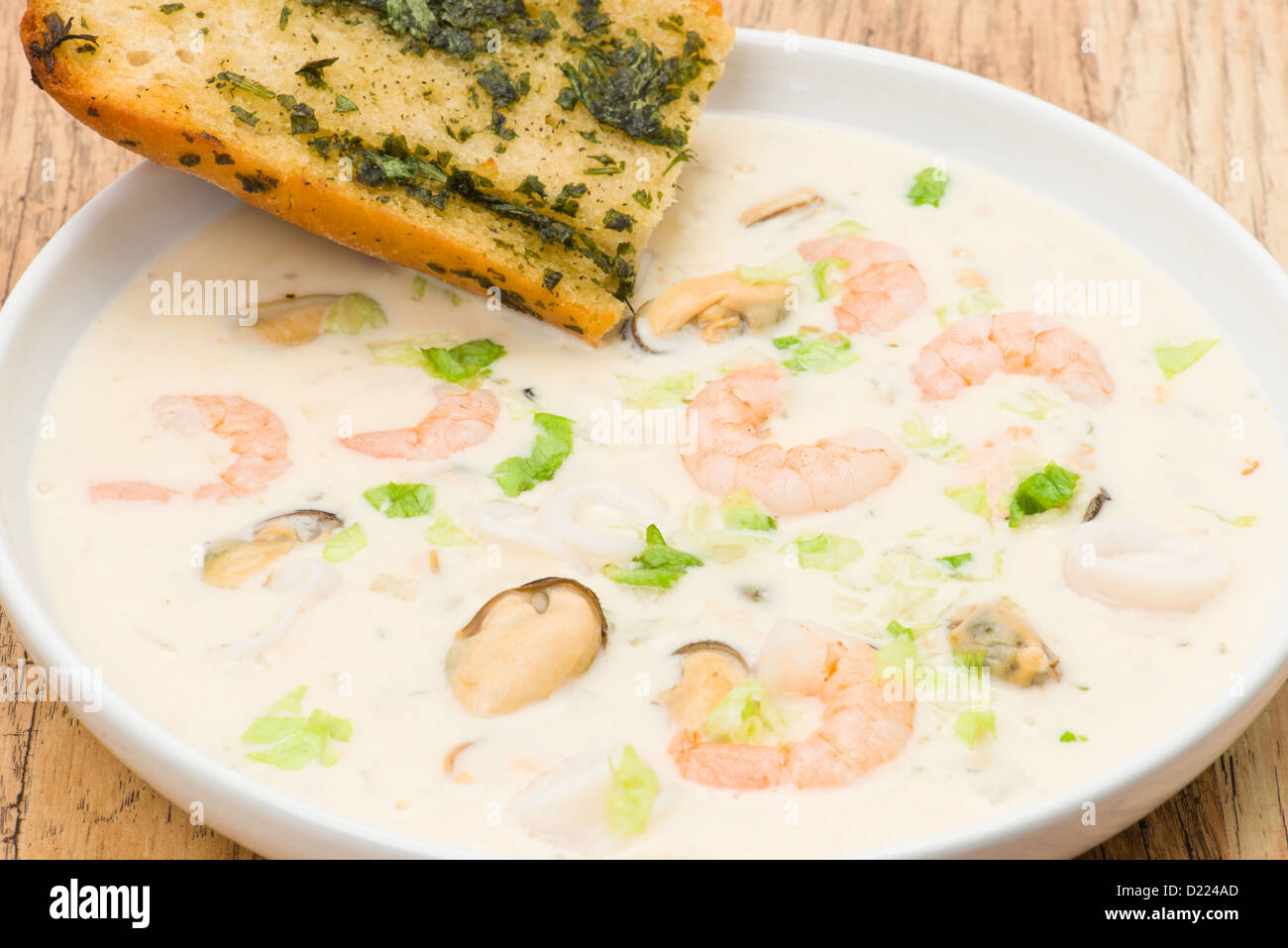Seafood chowder with garlic bread hi-res stock photography and images ...