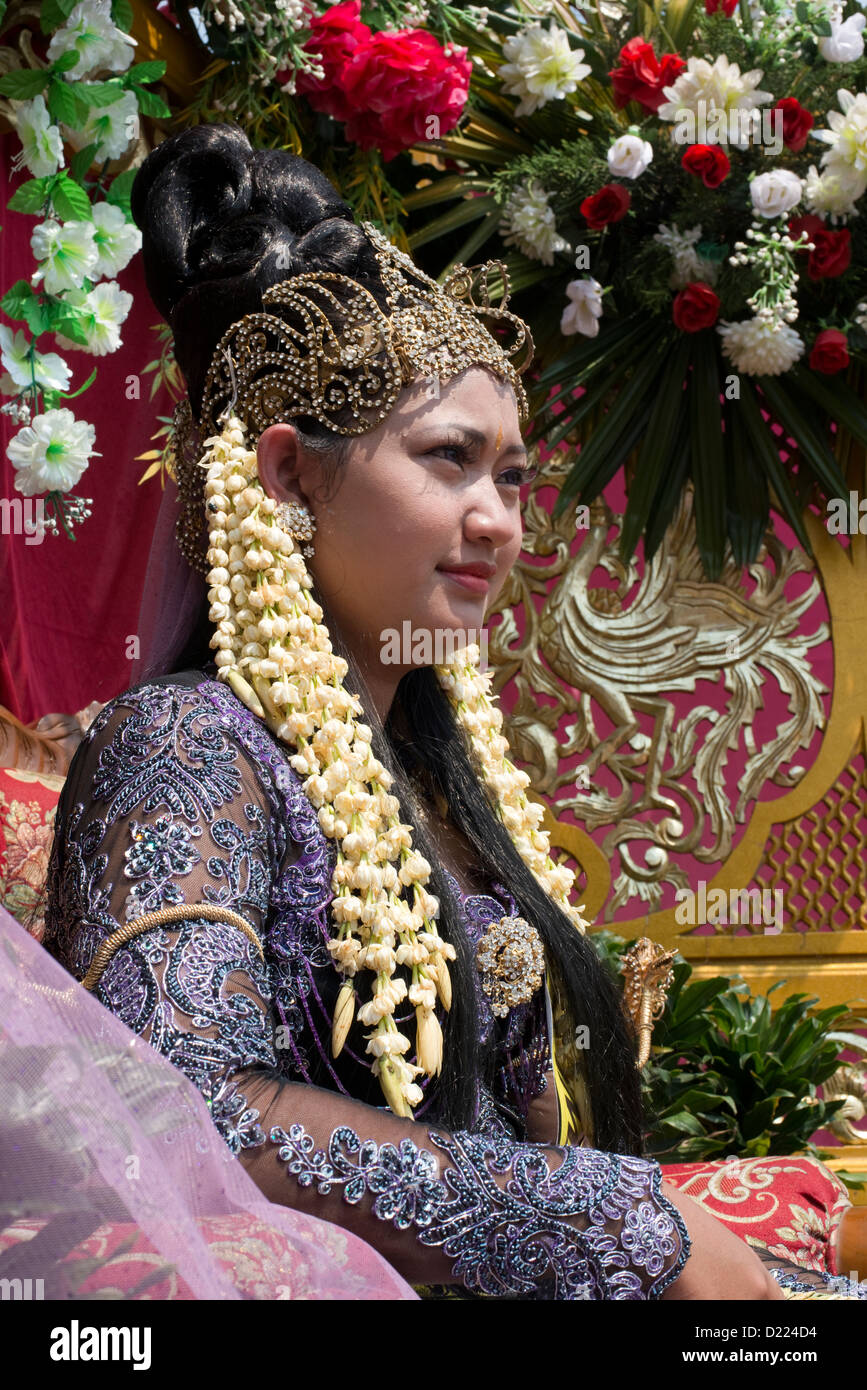 A participant rides in a float at a Harvest Festival parade in the ...