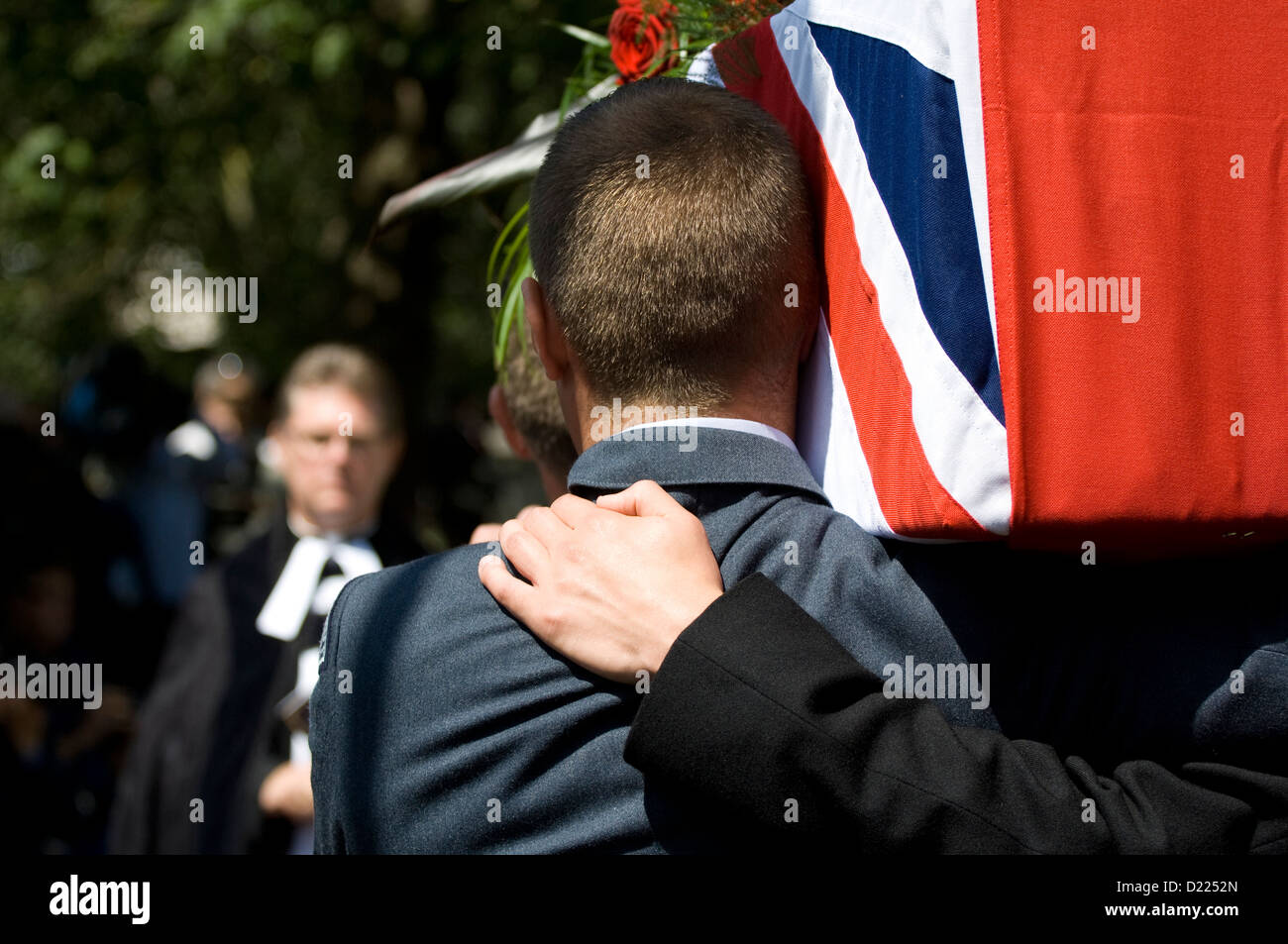 Pallbearers carry a Union Jack draped coffin at a military funeral in ...