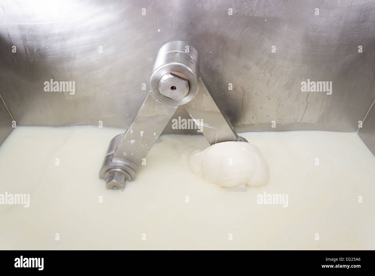 Detail take of a machine processing fermenting milk Stock Photo - Alamy